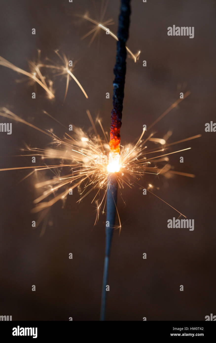 Sparkler burning and glowing in the dark Stock Photo - Alamy