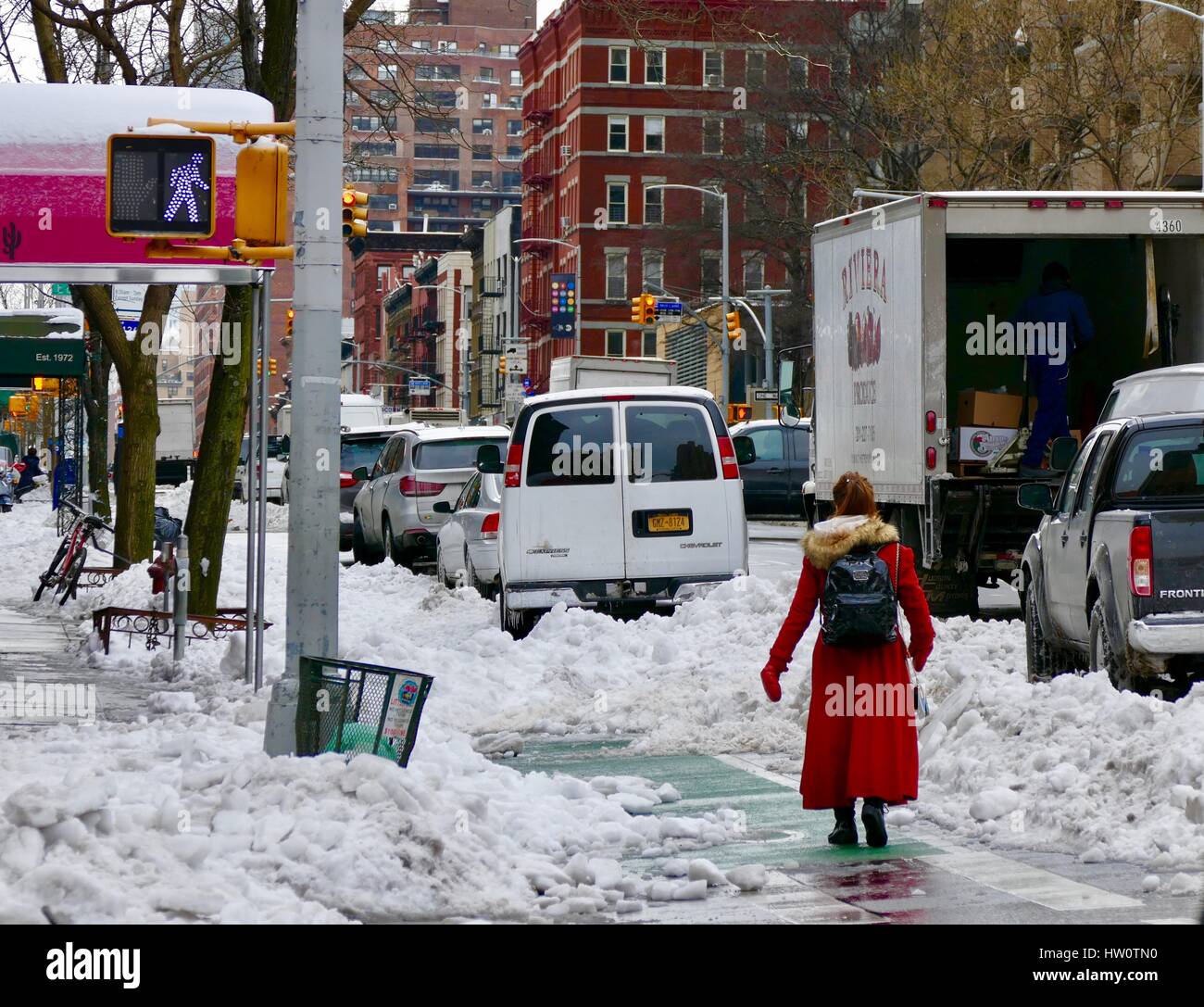 NYC street scene day after Storm Stella. Pedestrians and cars navigate ...