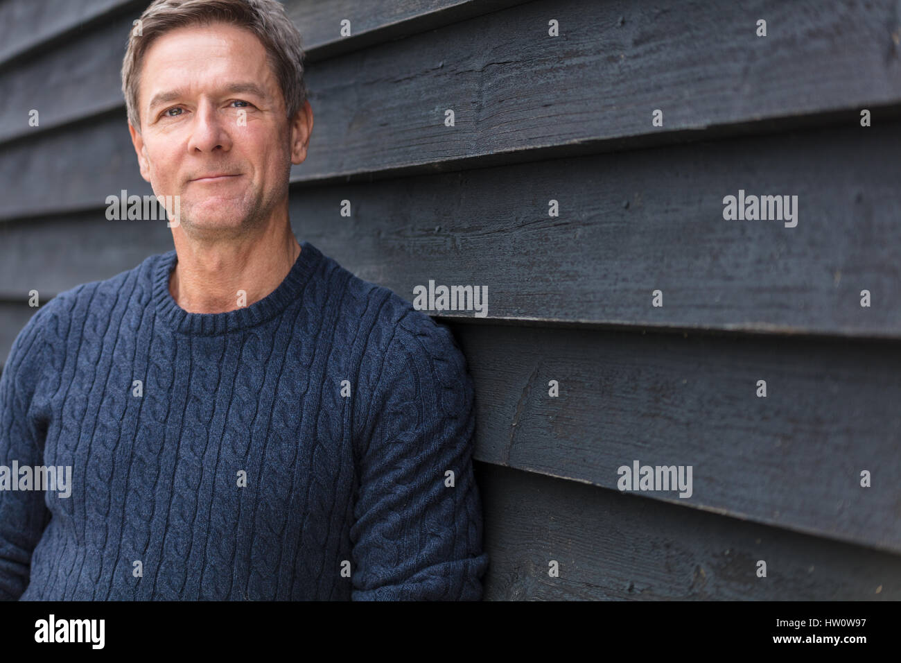 Portrait shot of an attractive, successful and happy middle aged man ...