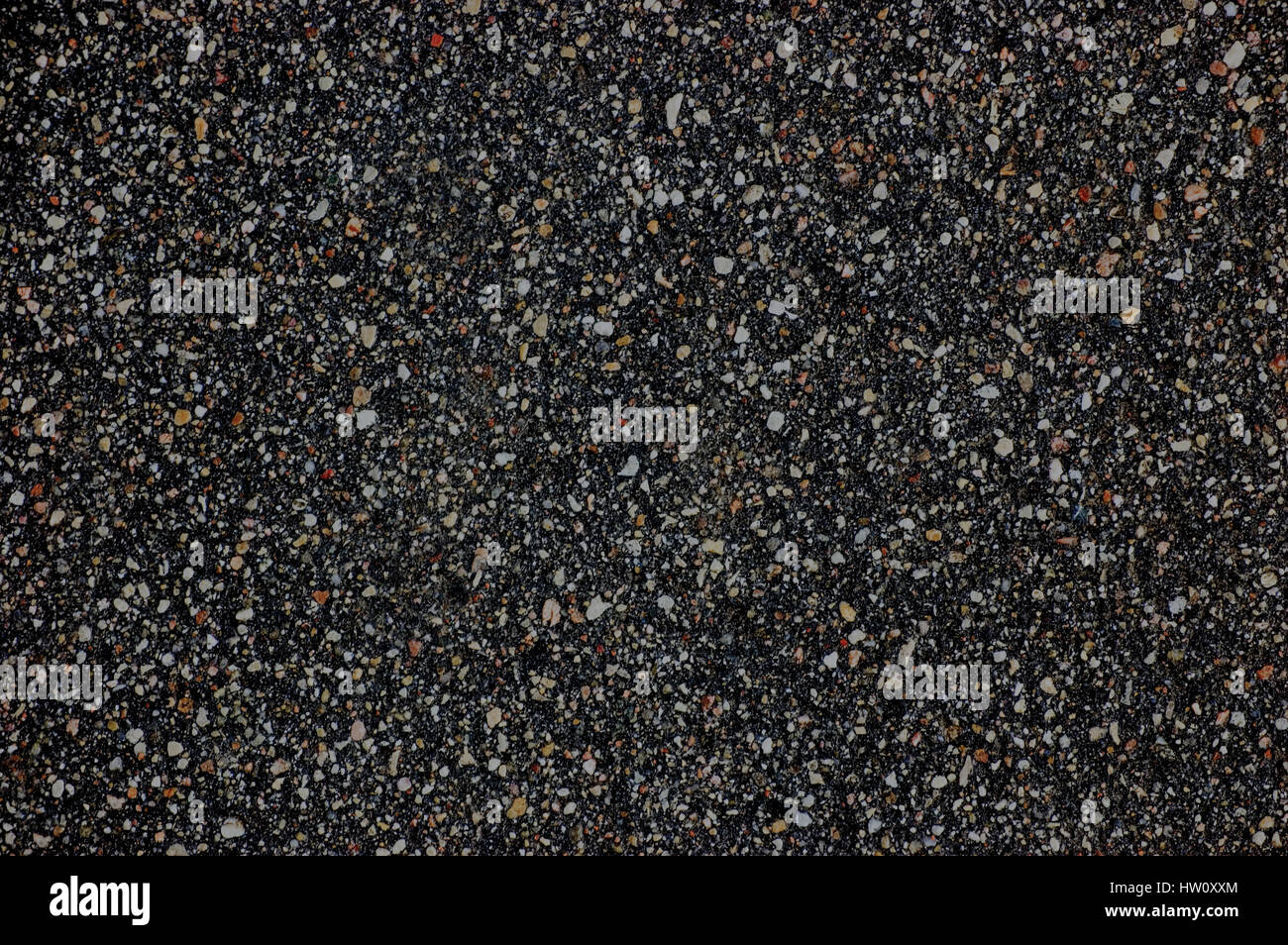 Asphalt texture, detailed wet tarmac pattern closeup, black gray ...