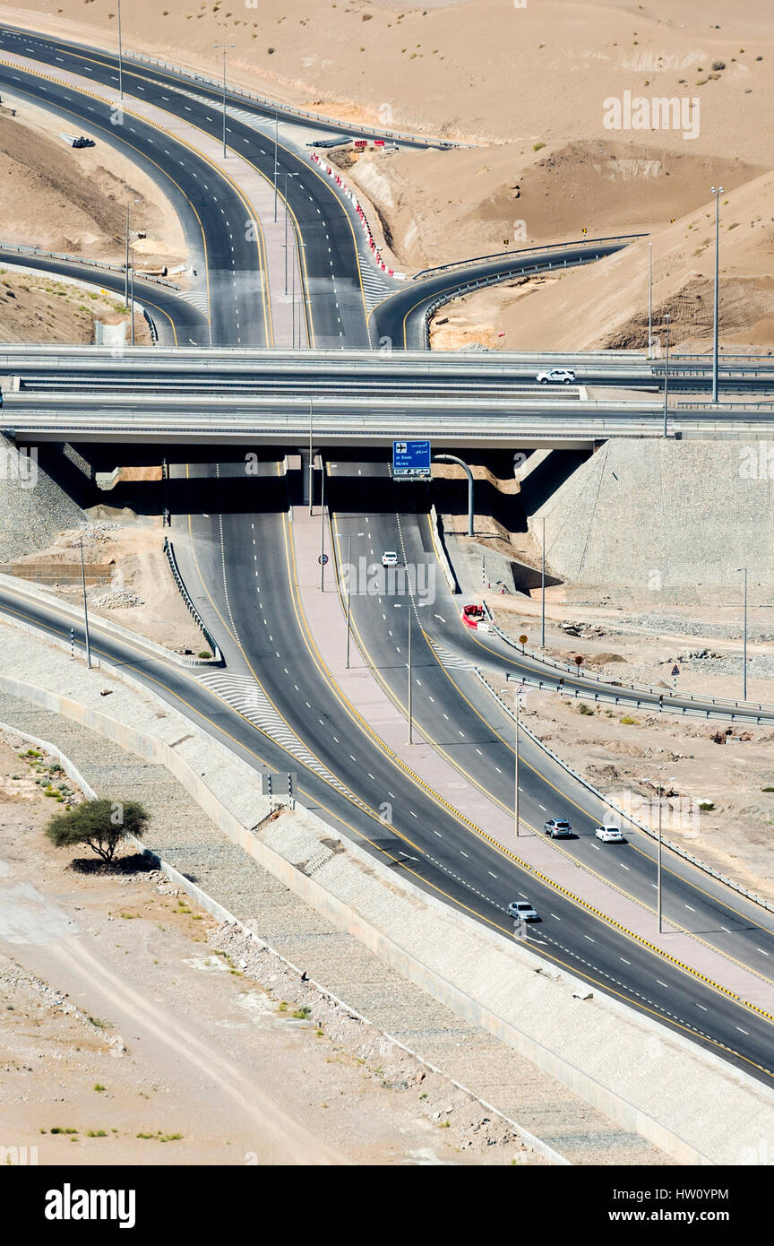A overpass bridge dissects an snaking freeway in the desert Stock Photo ...