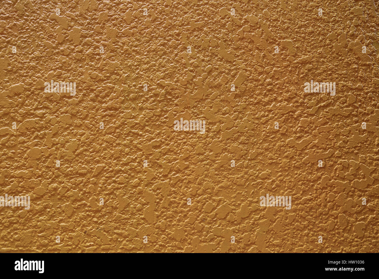Decorative plaster wall isolated ochre Stock Photo - Alamy