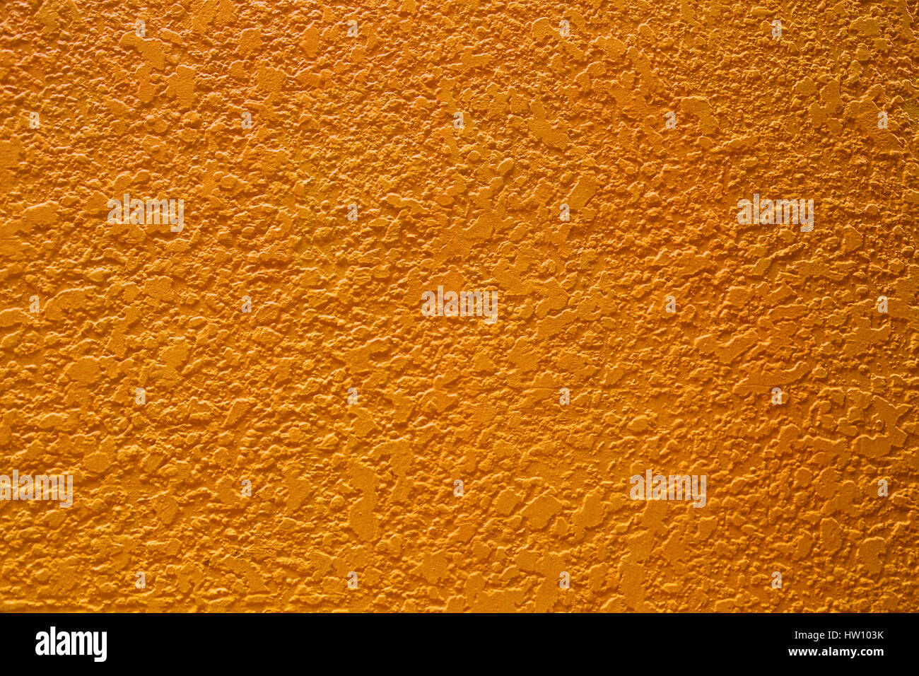 Decorative plaster wall isolated orange Stock Photo - Alamy