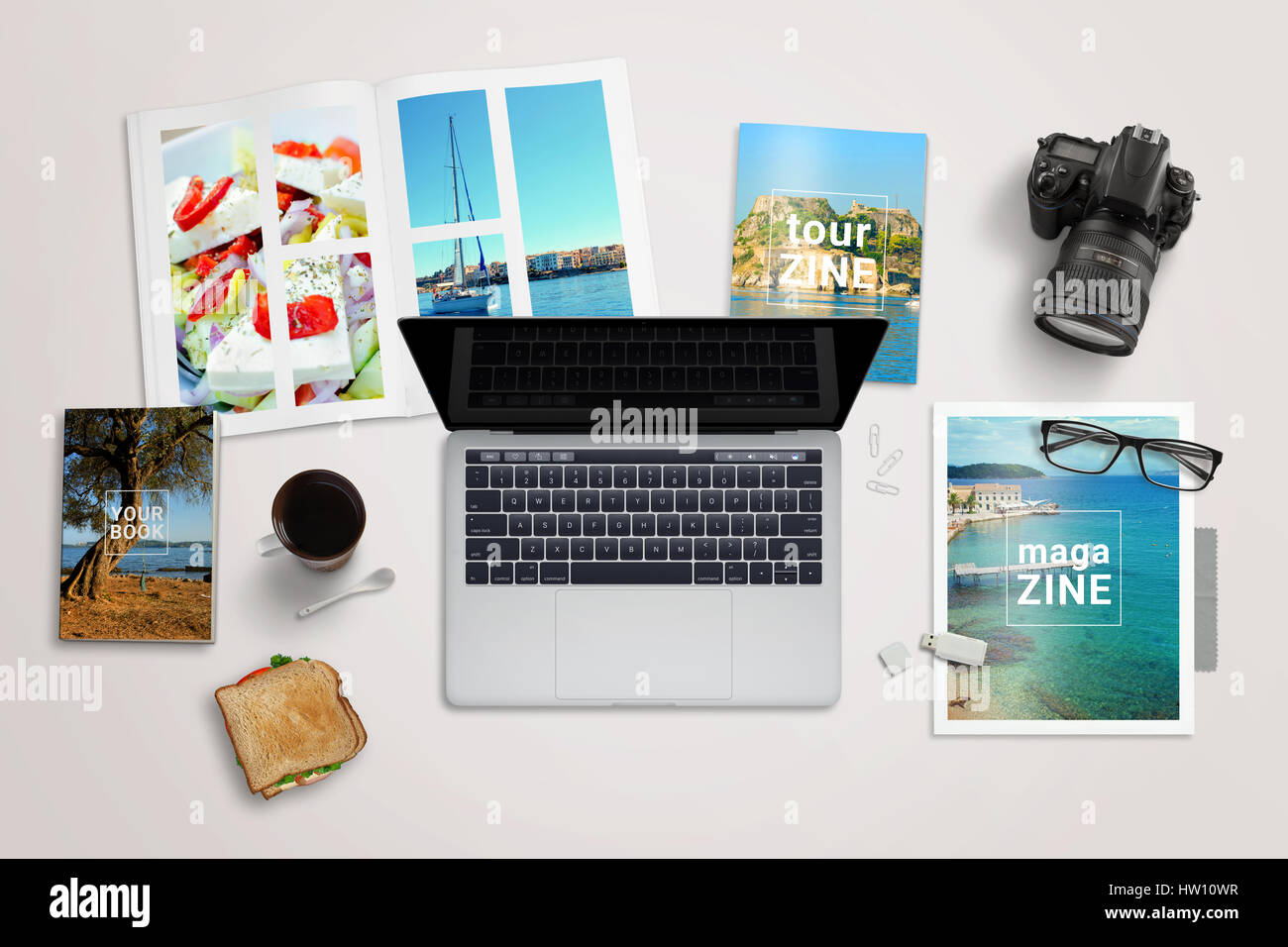 Journalist or reporter writing desk. Laptop surrounded by magazines ...