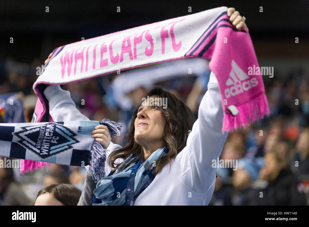 Soccer Sport Fans holding up team scarfs inside a indoor stadium Stock ...