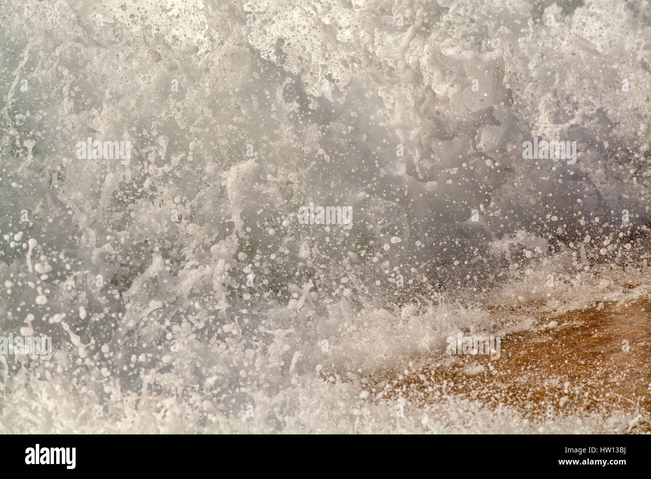 water breaking on sand background Stock Photo - Alamy