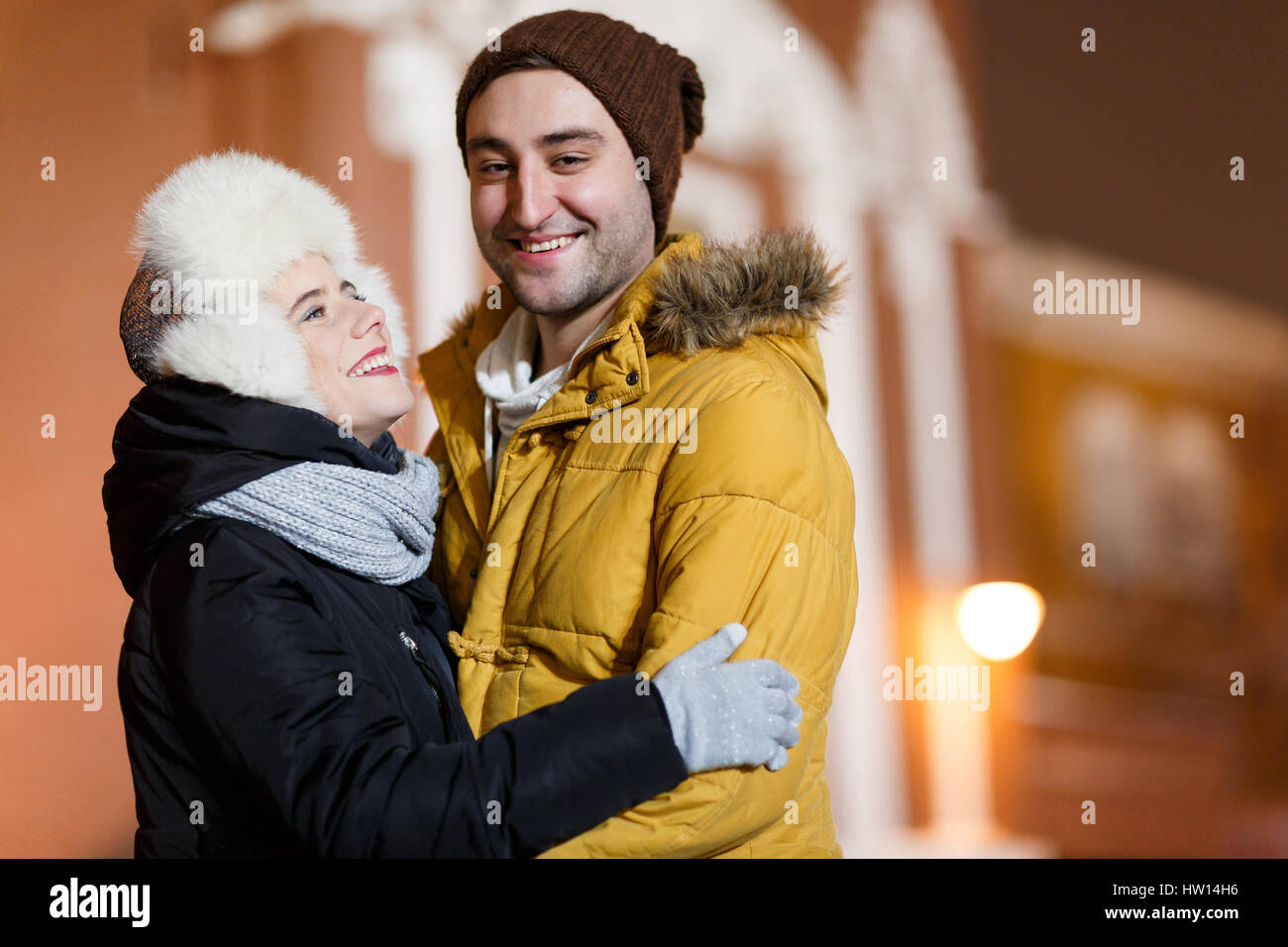 Happy people hugging on city Stock Photo - Alamy
