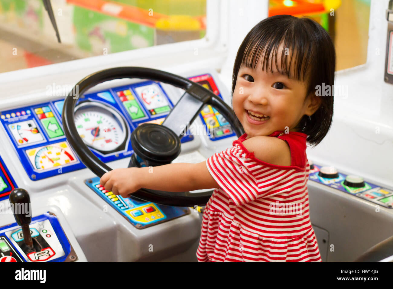 Little Asain Chinese Bus Driver at indoor playground Stock Photo - Alamy