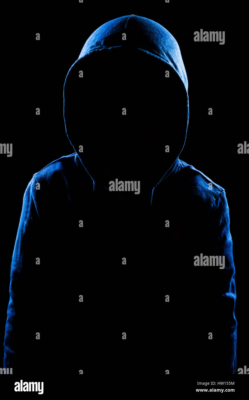 Anonymous user with hood in black background studio shot, faceless ...