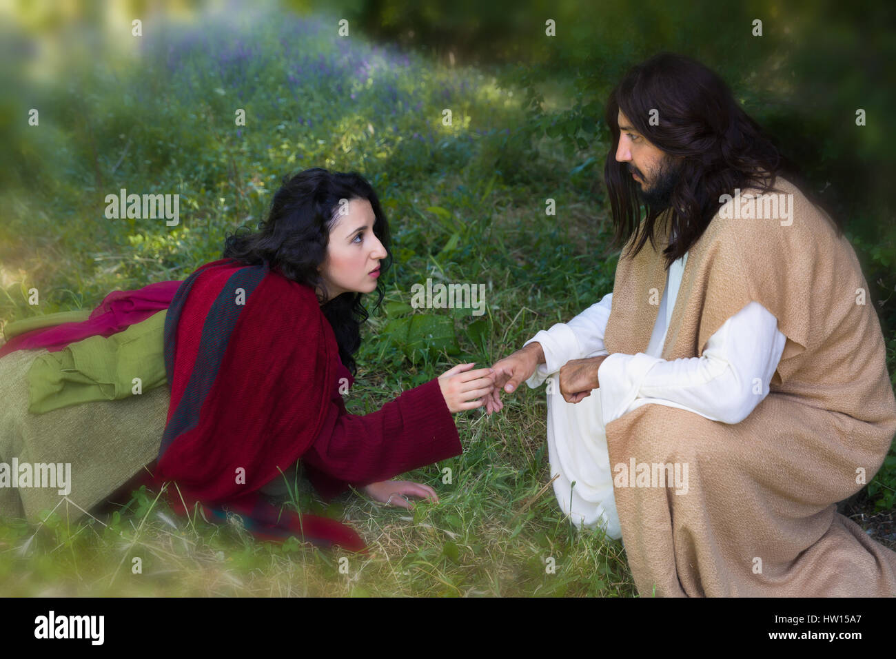 Repentant sinner woman touching the robe of Jesus, asking for ...