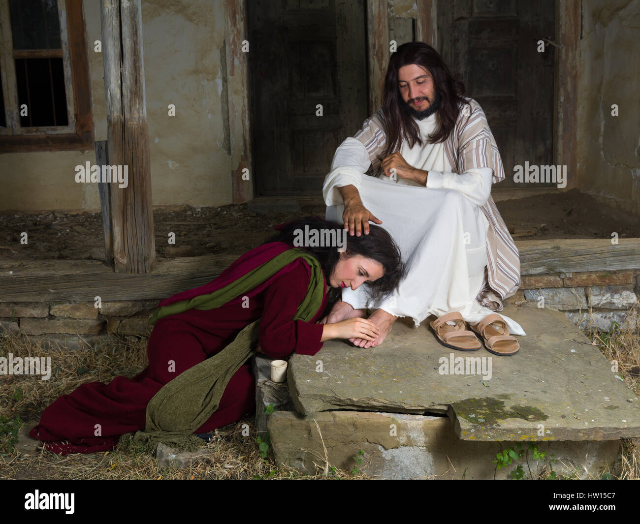 Mary Magdalene crying of shame and embalming Jesus' feet Stock Photo ...