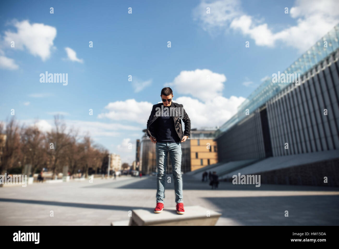 Funny guy jumping on the street with sunset Stock Photo - Alamy