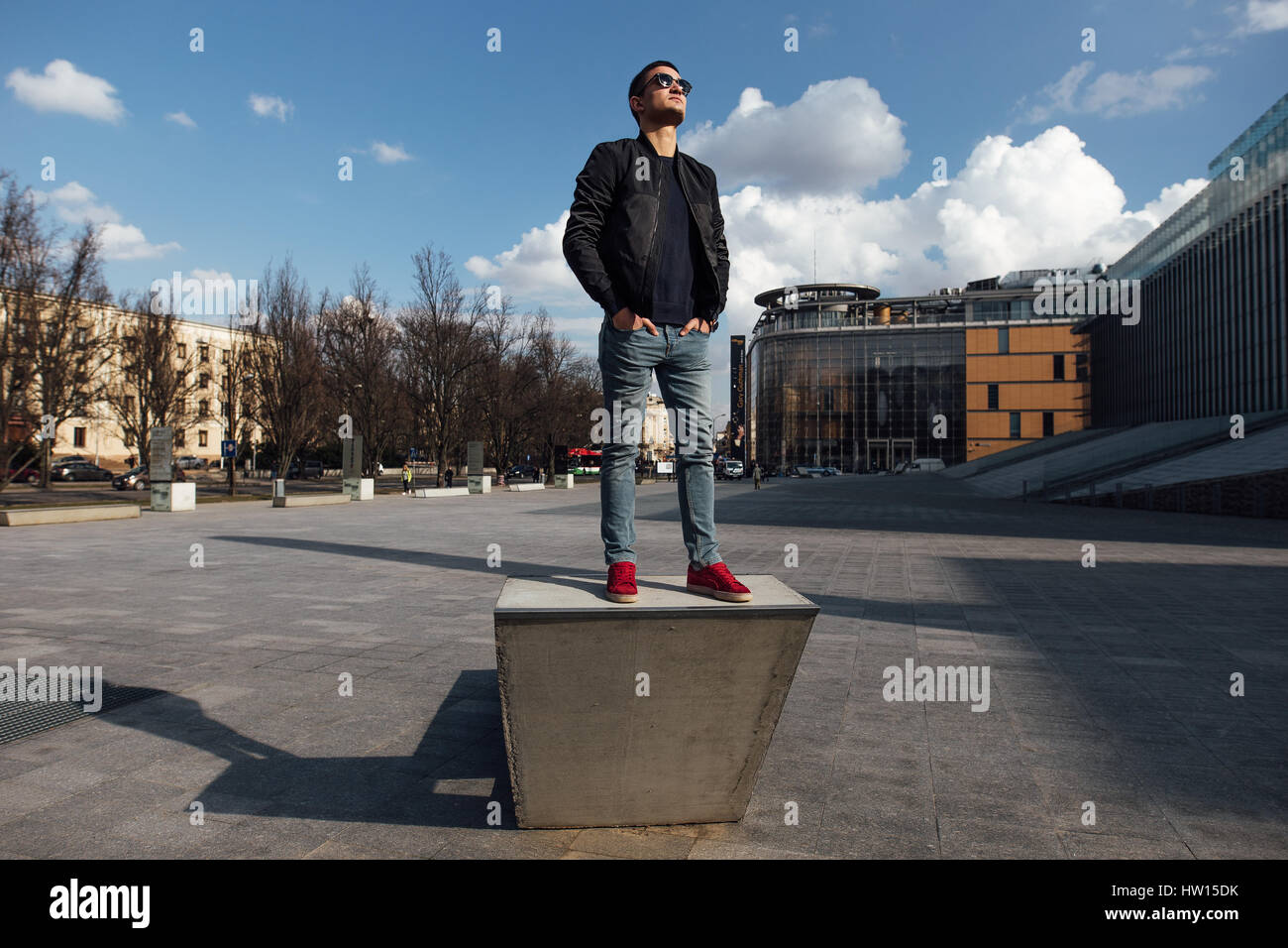 Funny guy jumping on the street with sunset Stock Photo - Alamy