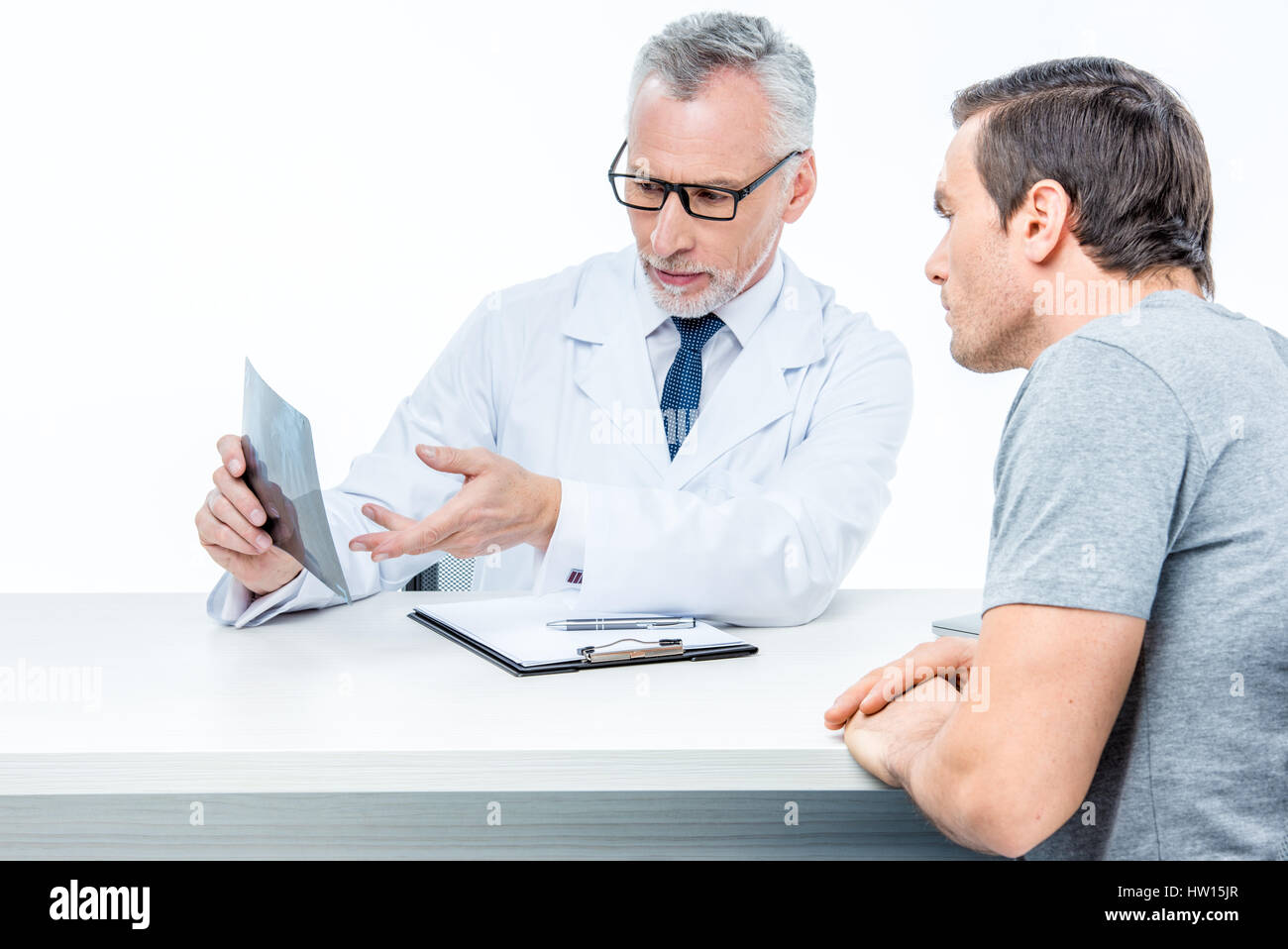 Doctor shows x-ray image Stock Photo - Alamy