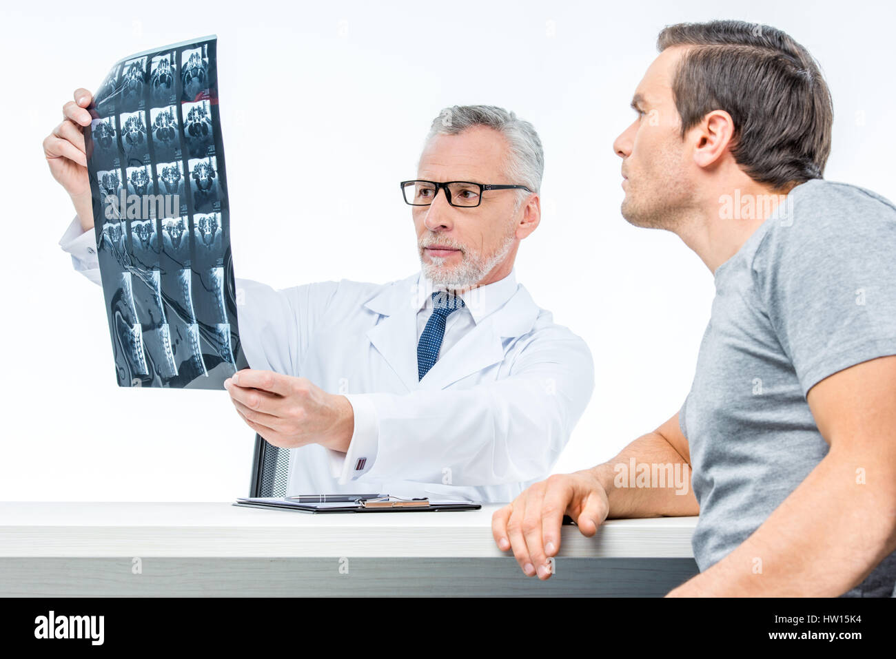 Doctor shows x-ray image Stock Photo - Alamy