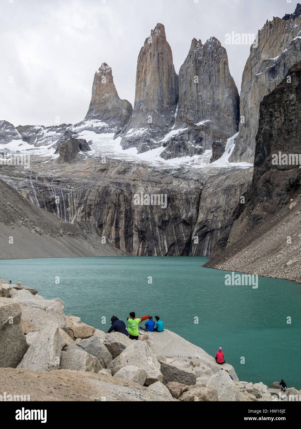 Hikers at the viewpoint Mirador Las Torres, view over the lagoon to the ...