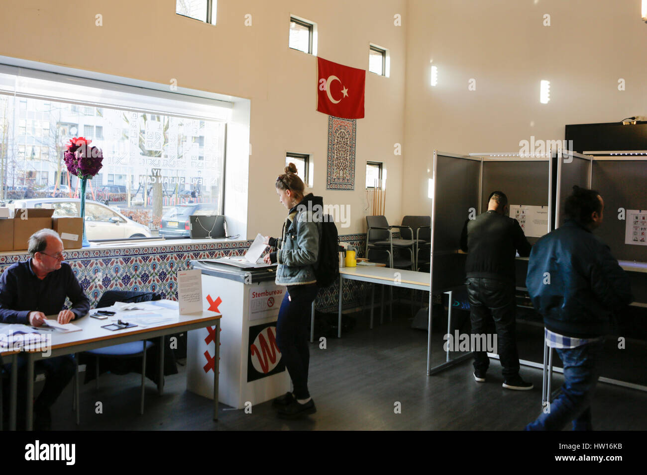 Amsterdam, Netherlands. 15th Mar, 2017. A female voter puts her ballot ...