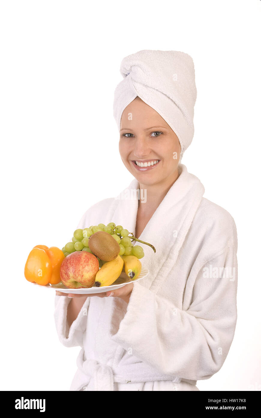 Woman in the bathrobe eats fruit, Frau im Bademantel isst Obst Stock ...