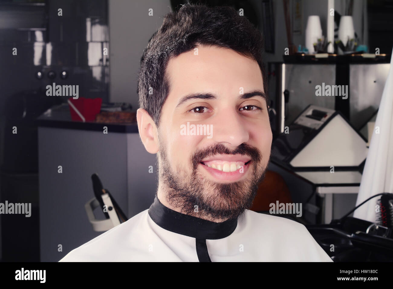 Young latin man cutting hi-res stock photography and images - Alamy