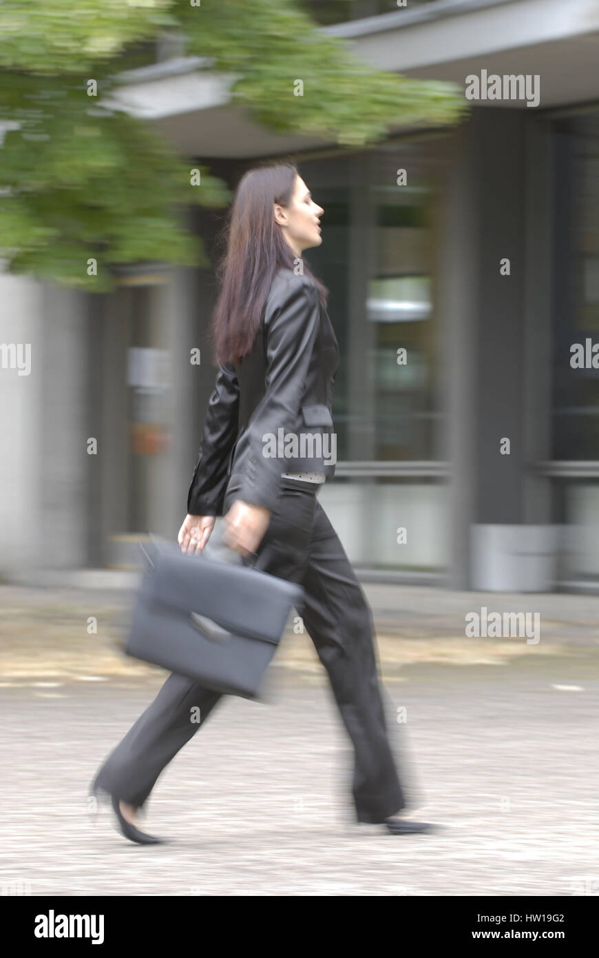 Young woman with briefcase, Junge Frau mit Aktentasche Stock Photo - Alamy