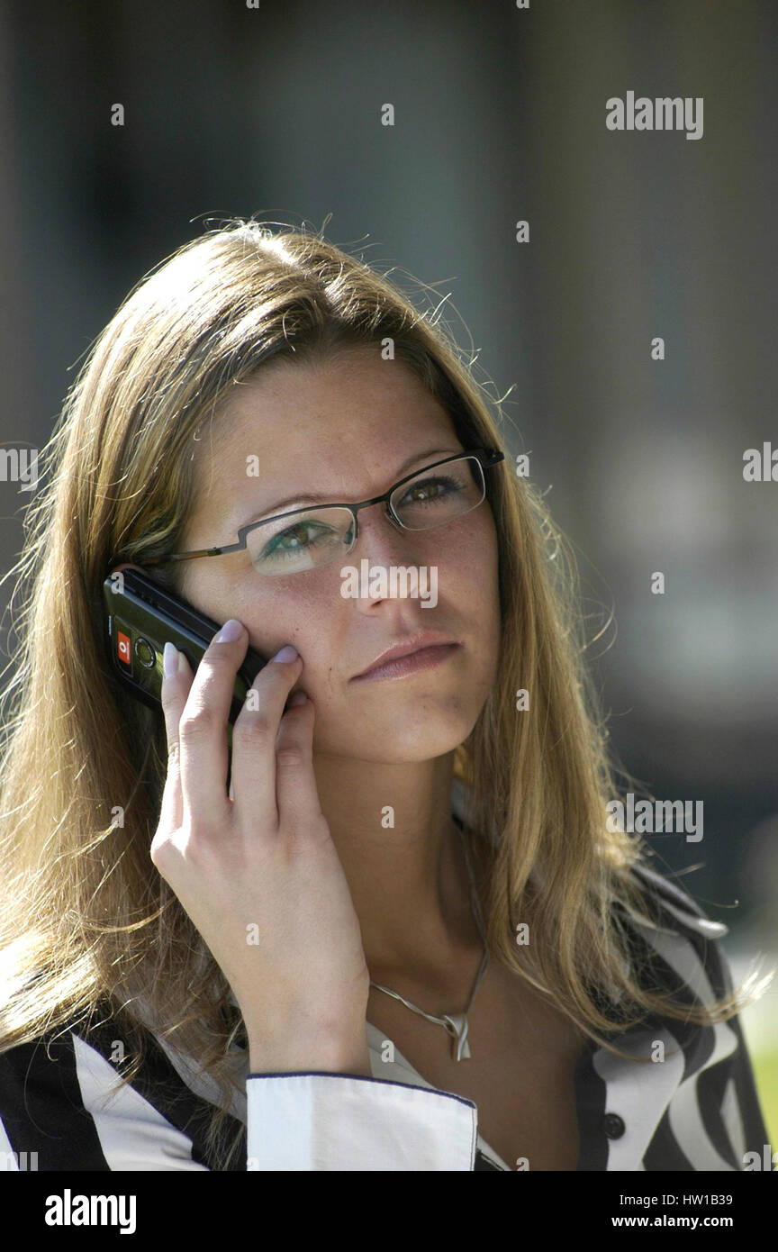 Young woman with a mobile phone, Junge Frau mit einem Handy Stock Photo ...