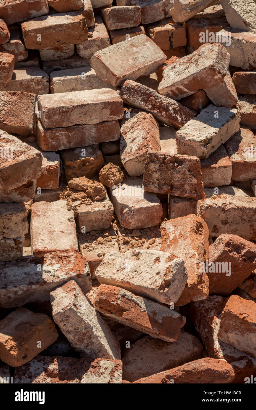 A pile of used red bricks from a demolished building Stock Photo - Alamy