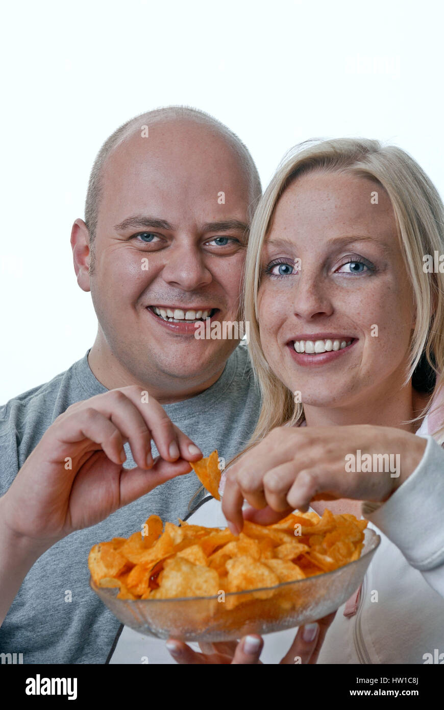 Chips eat, Chips essen Stock Photo - Alamy