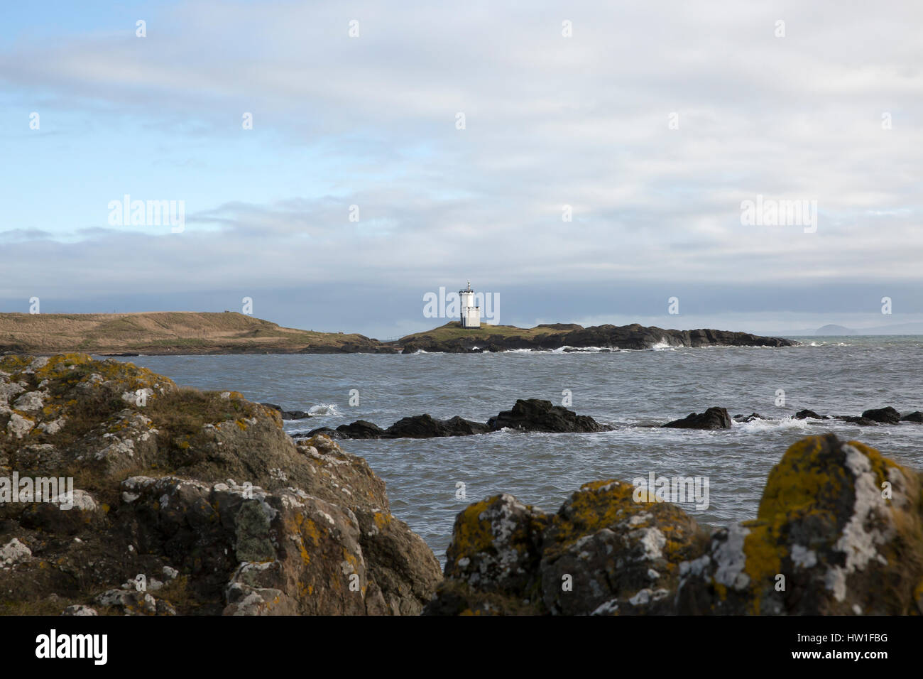 Lighthouse on the rocks in Elie, Scotland Stock Photo - Alamy
