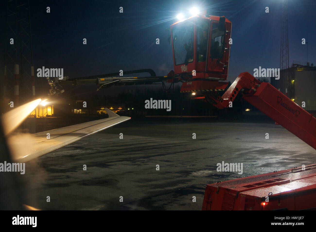 OSLO, NORWAY- JAN 21st, 2017: Process of aircraft wings de-icing with ...