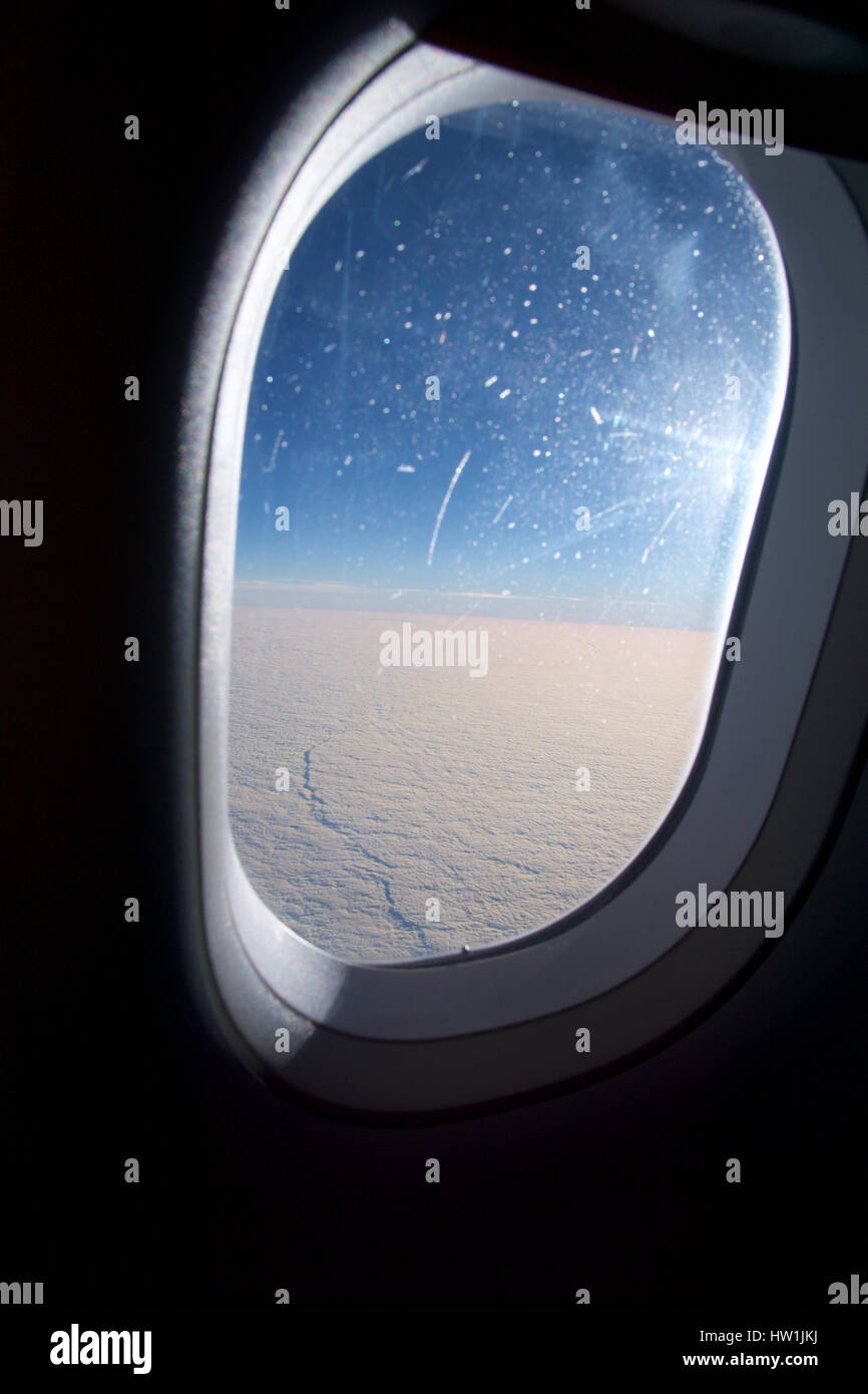 OSLO, NORWAY - JAN 21st, 2017: Closeup of the airplane window with the ...