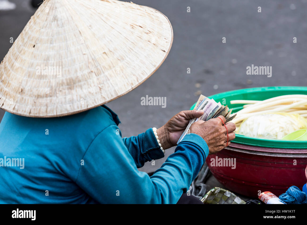 Poor woman counting money outside hi-res stock photography and images ...
