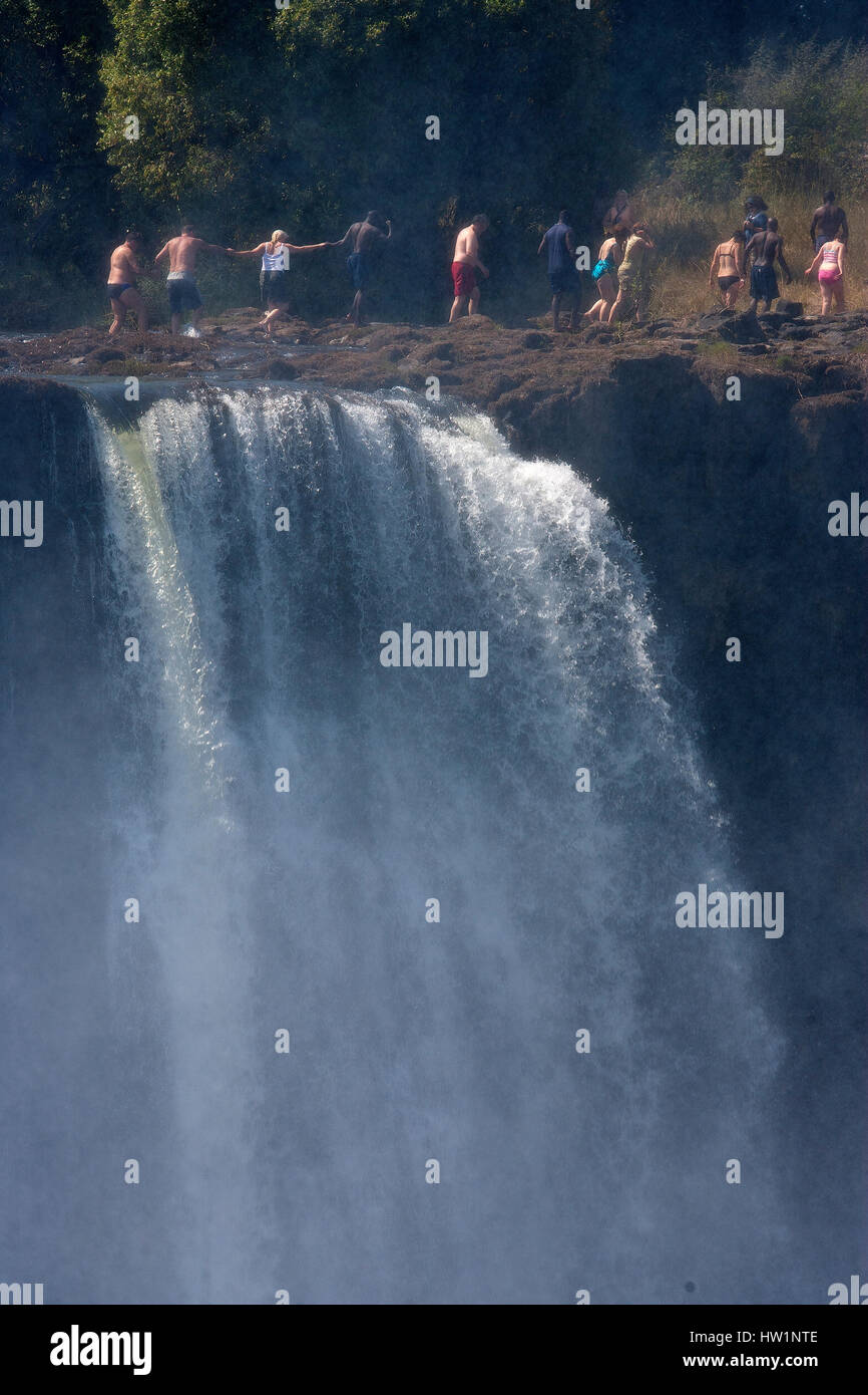 Tourists on Devil Pool in Victoria Falls on zambezi river, discovered ...