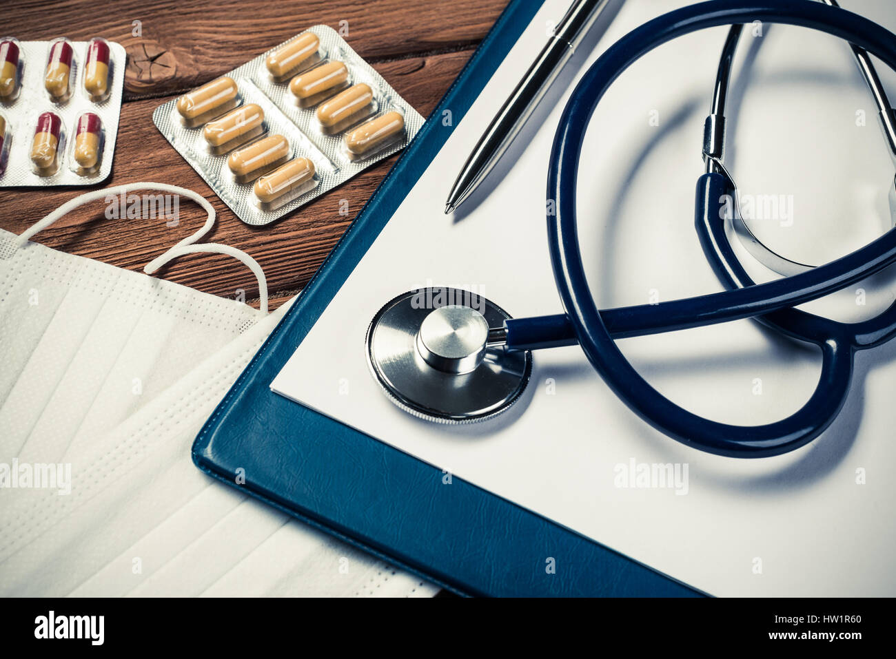 Desk of doctor with medicine things Stock Photo - Alamy