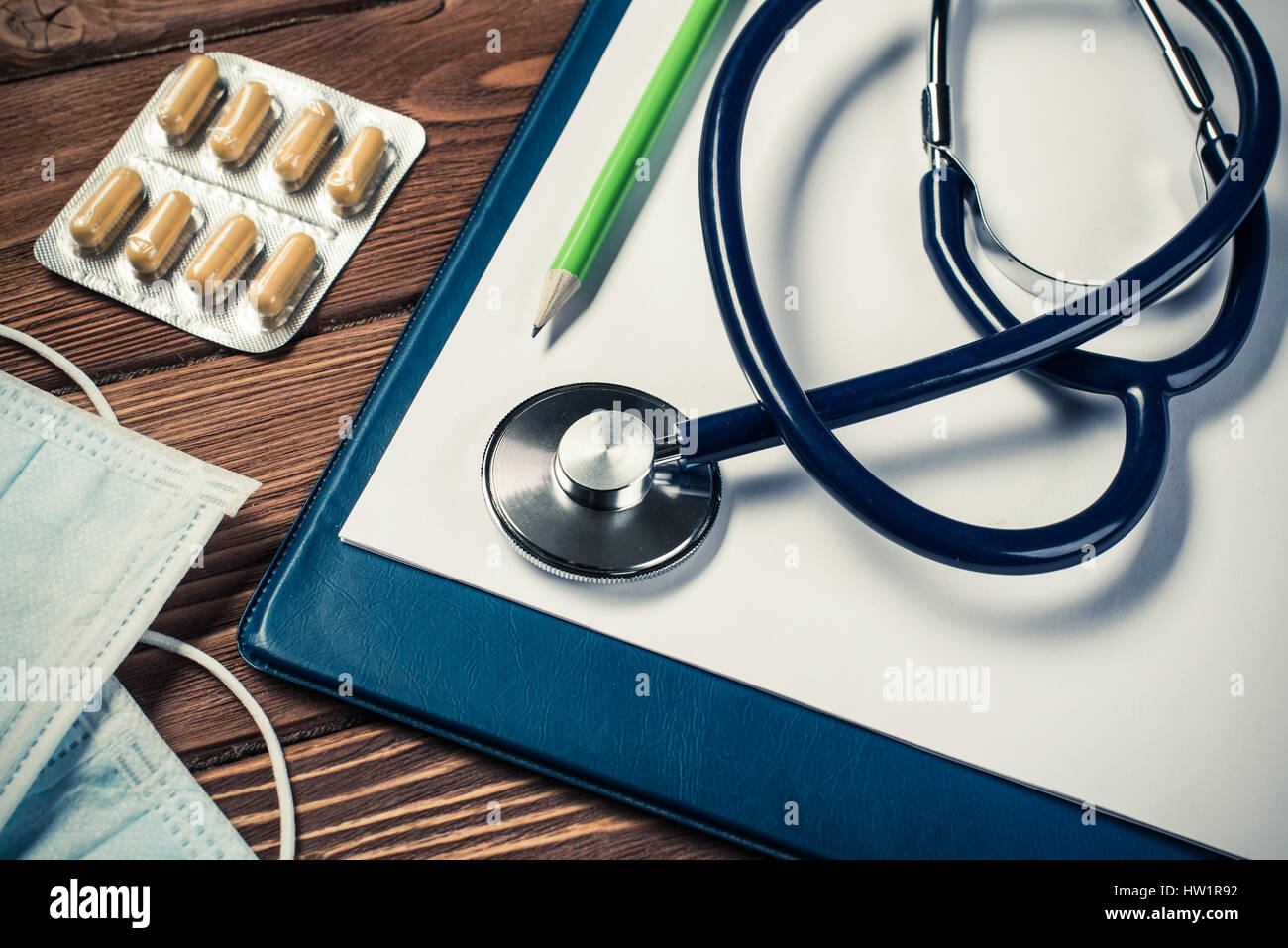 Desk of doctor with medicine things Stock Photo - Alamy