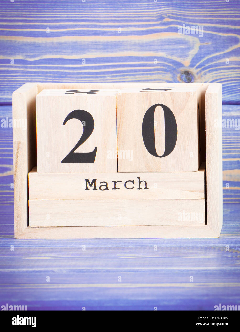 March 20th. Date of 20 March on wooden cube calendar, purple board as ...
