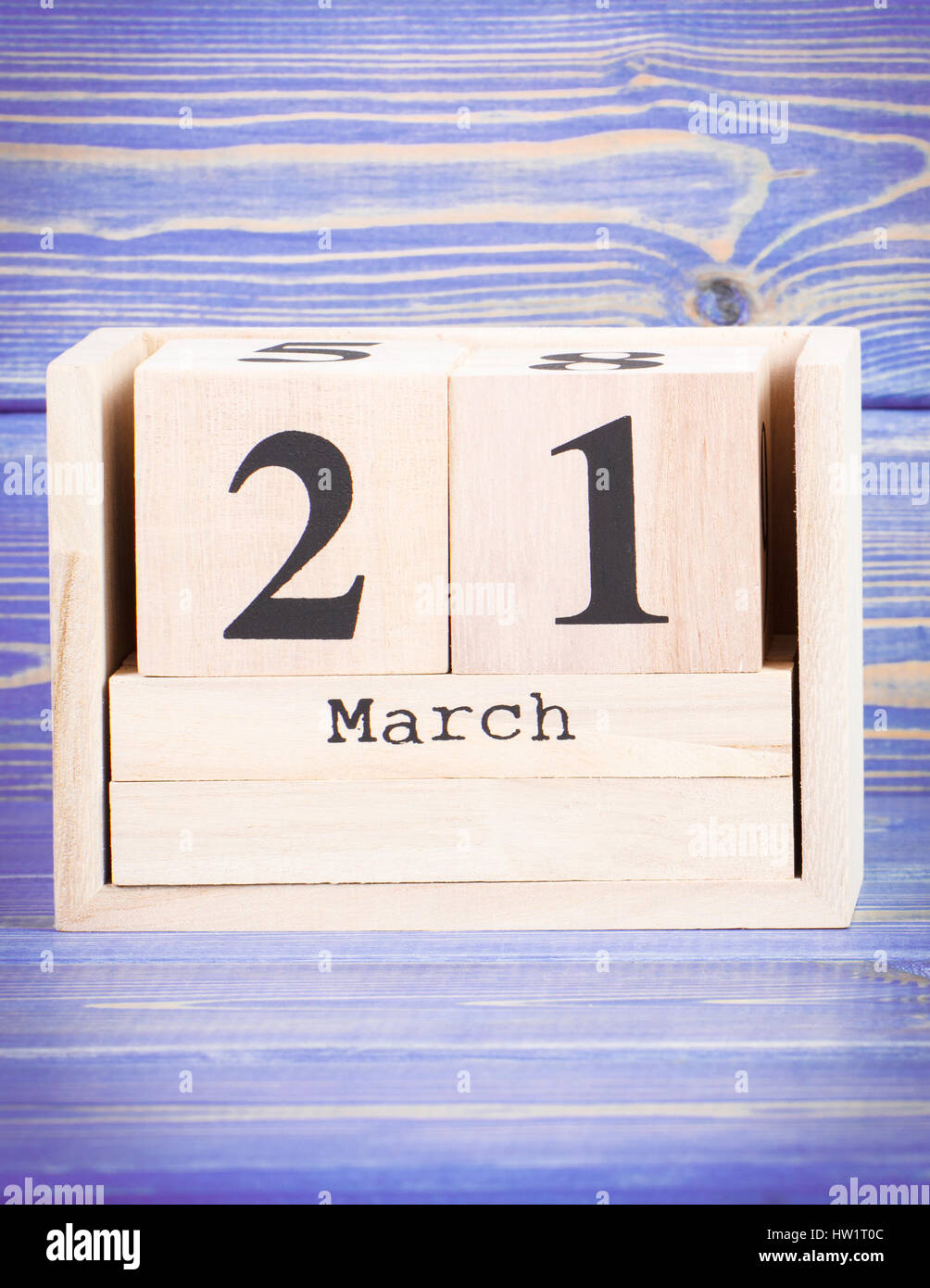 March 21th. Date of 21 March on wooden cube calendar, purple board as ...