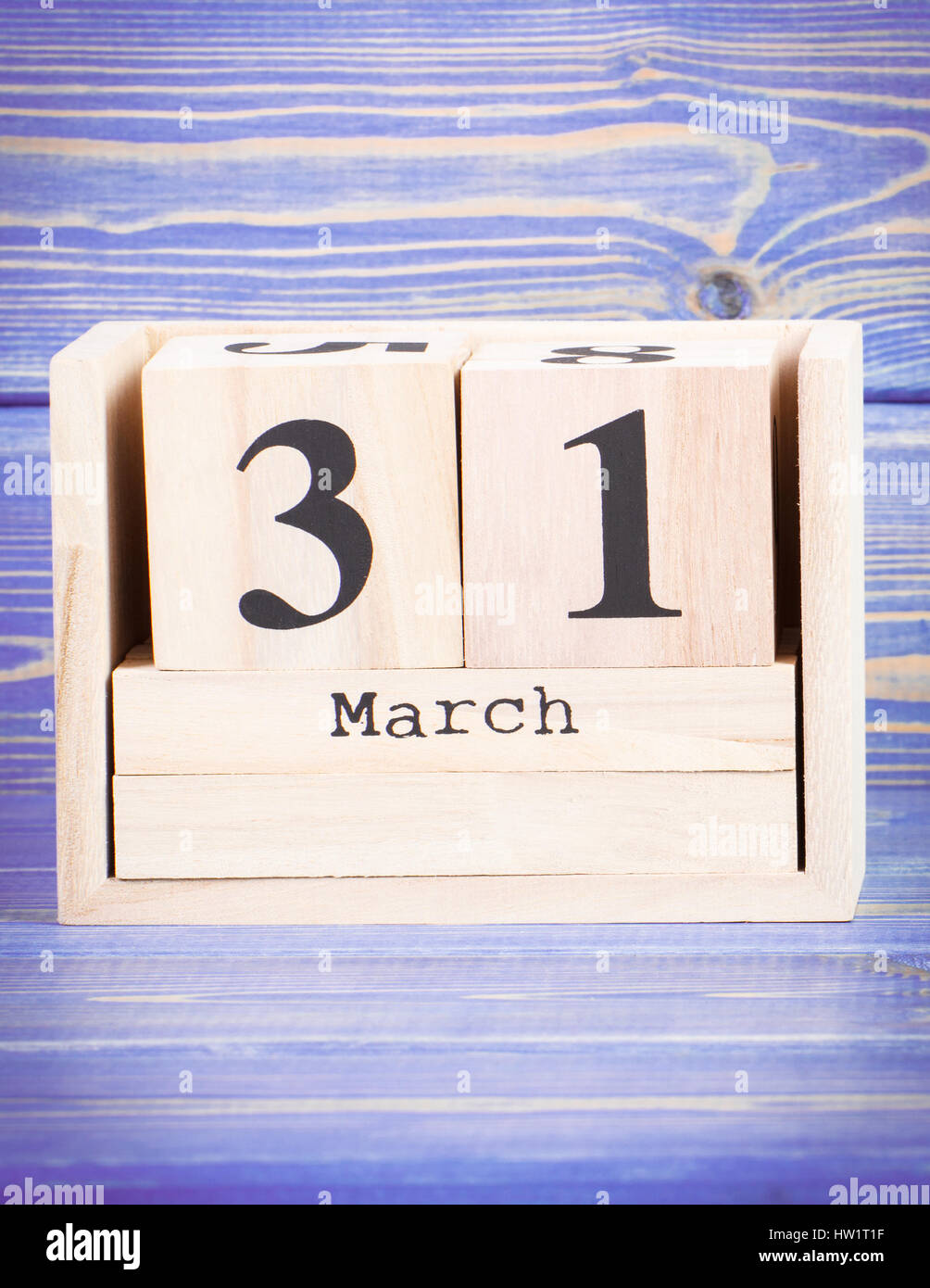 March 31th. Date of 31 March on wooden cube calendar, purple board as ...