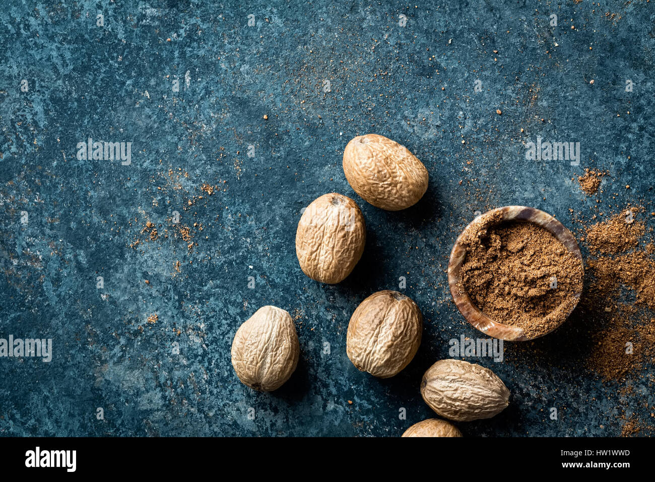 Nutmeg on dark background directly above copy space Stock Photo - Alamy