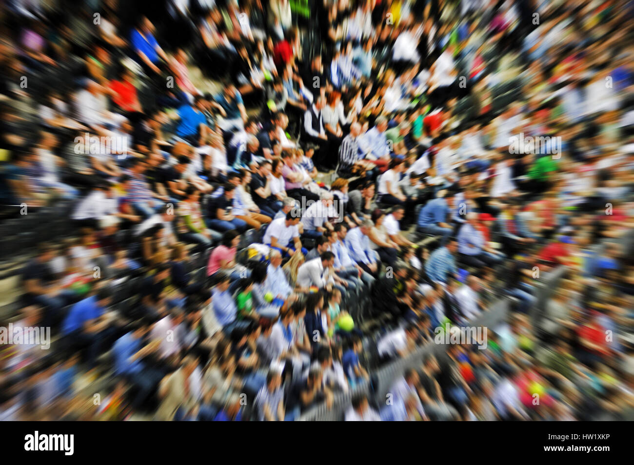 Blurred crowd of spectators on a stadium tribune at a basketball match ...