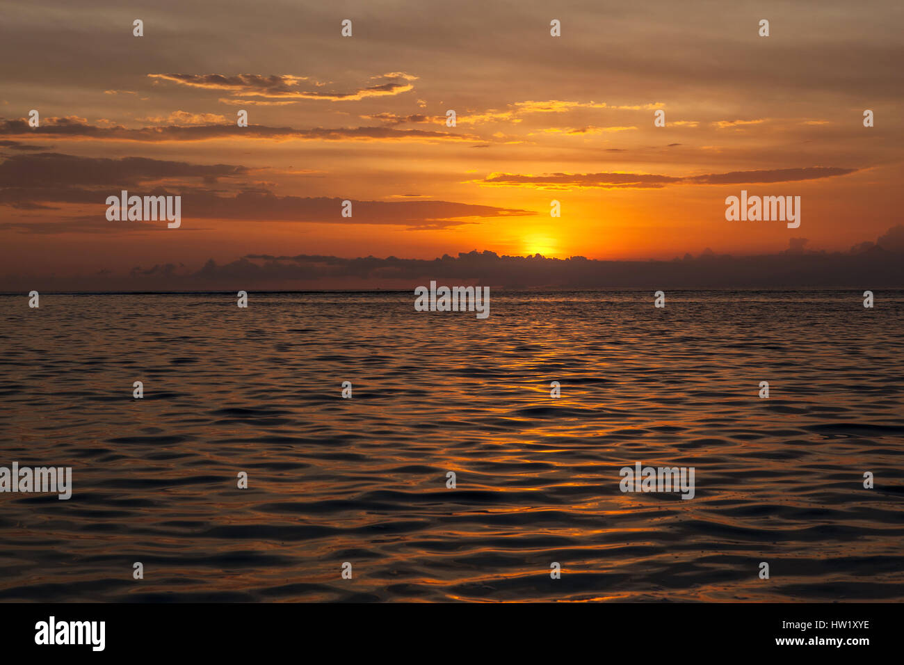 Sunset in the ocean, dramatic sky, Indonesia Bali Stock Photo - Alamy