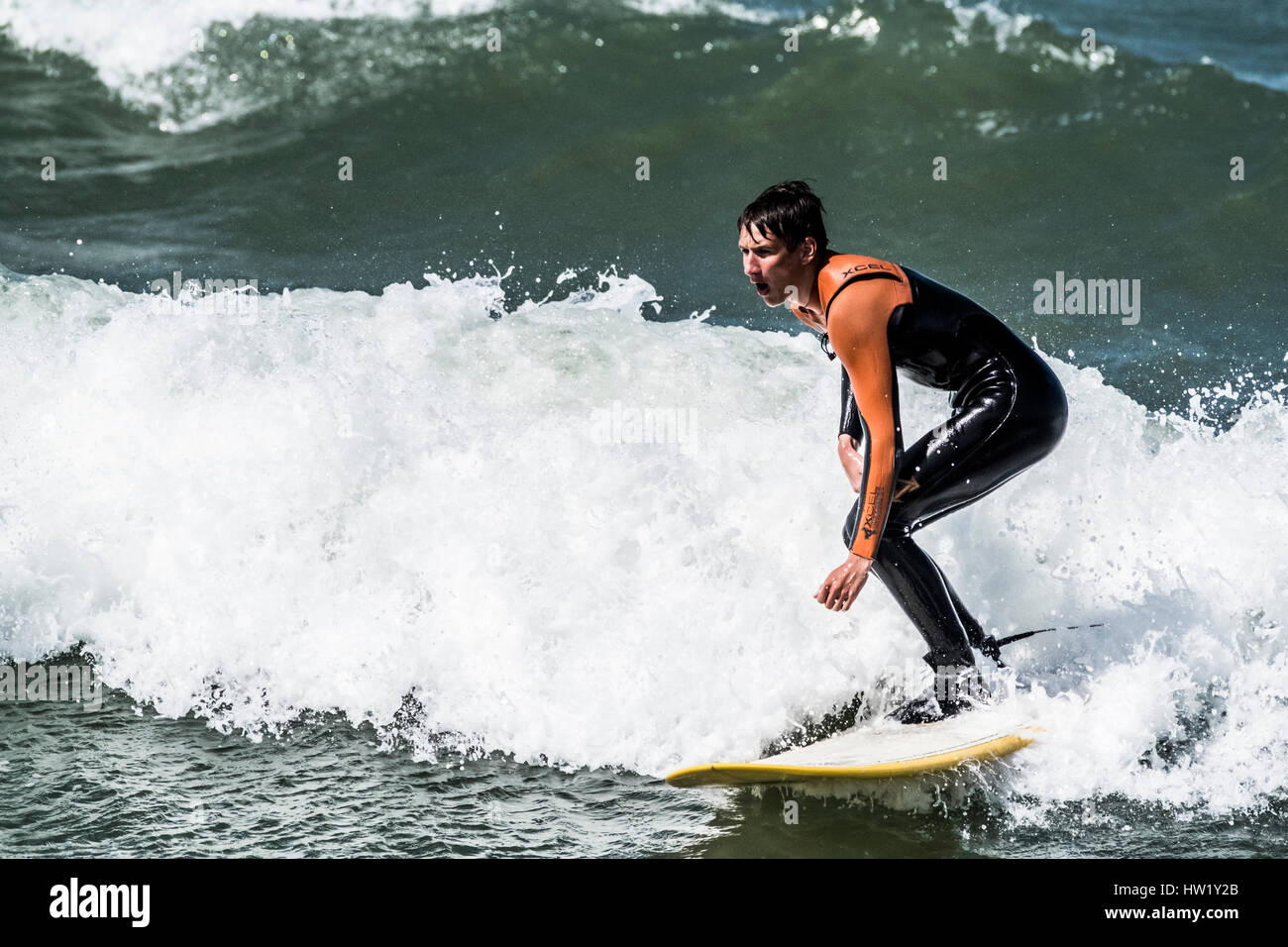A surfer in Klitmoller which is a popular surfing destination in ...