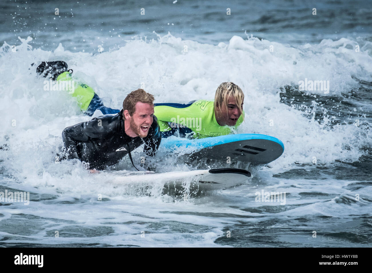 Two surfers in Klitmoller which is a popular surfing destination in ...
