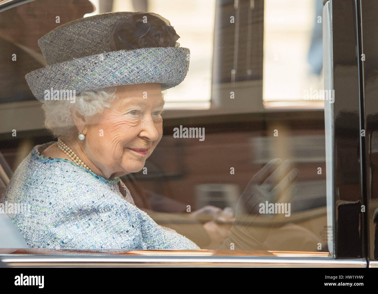 Queen Elizabeth II waves from her car as she leaves after officially ...