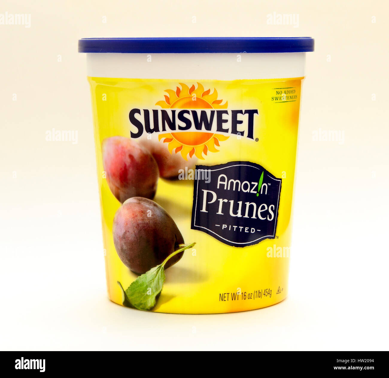 A bucket of Sunsweet pitted prunes stands against white background ...
