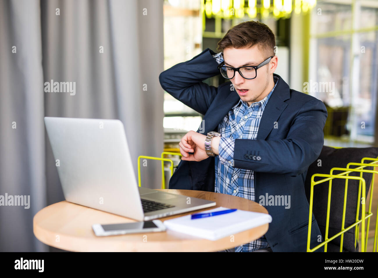 Frustrated businessman checking time hi-res stock photography and ...