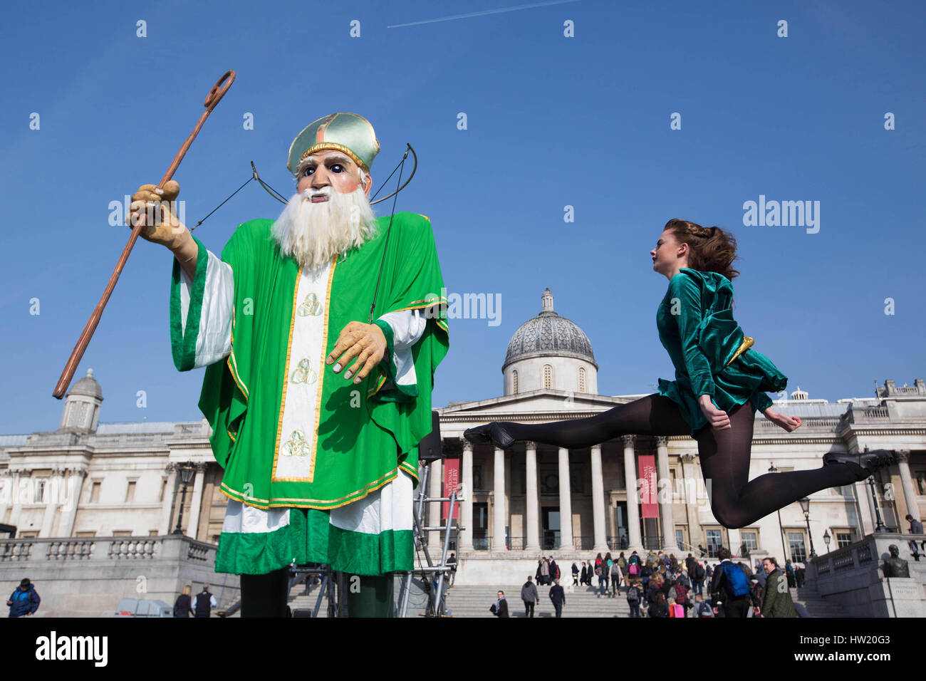 EDITORIAL USE ONLY A 16ft tall puppet of St Patrick and an Irish dancer ...