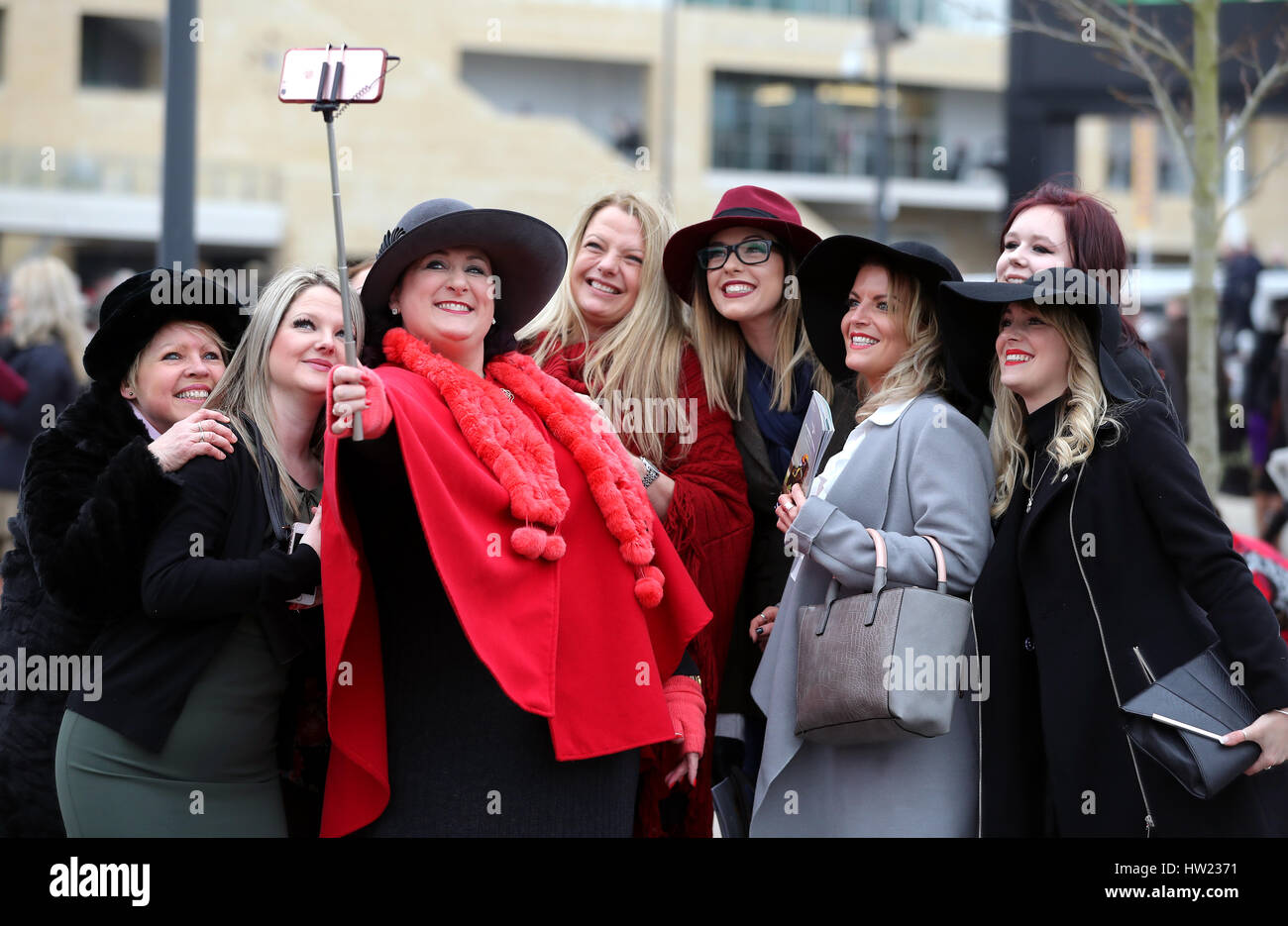A group of female racegoers pose for a selfie during St Patrick's ...