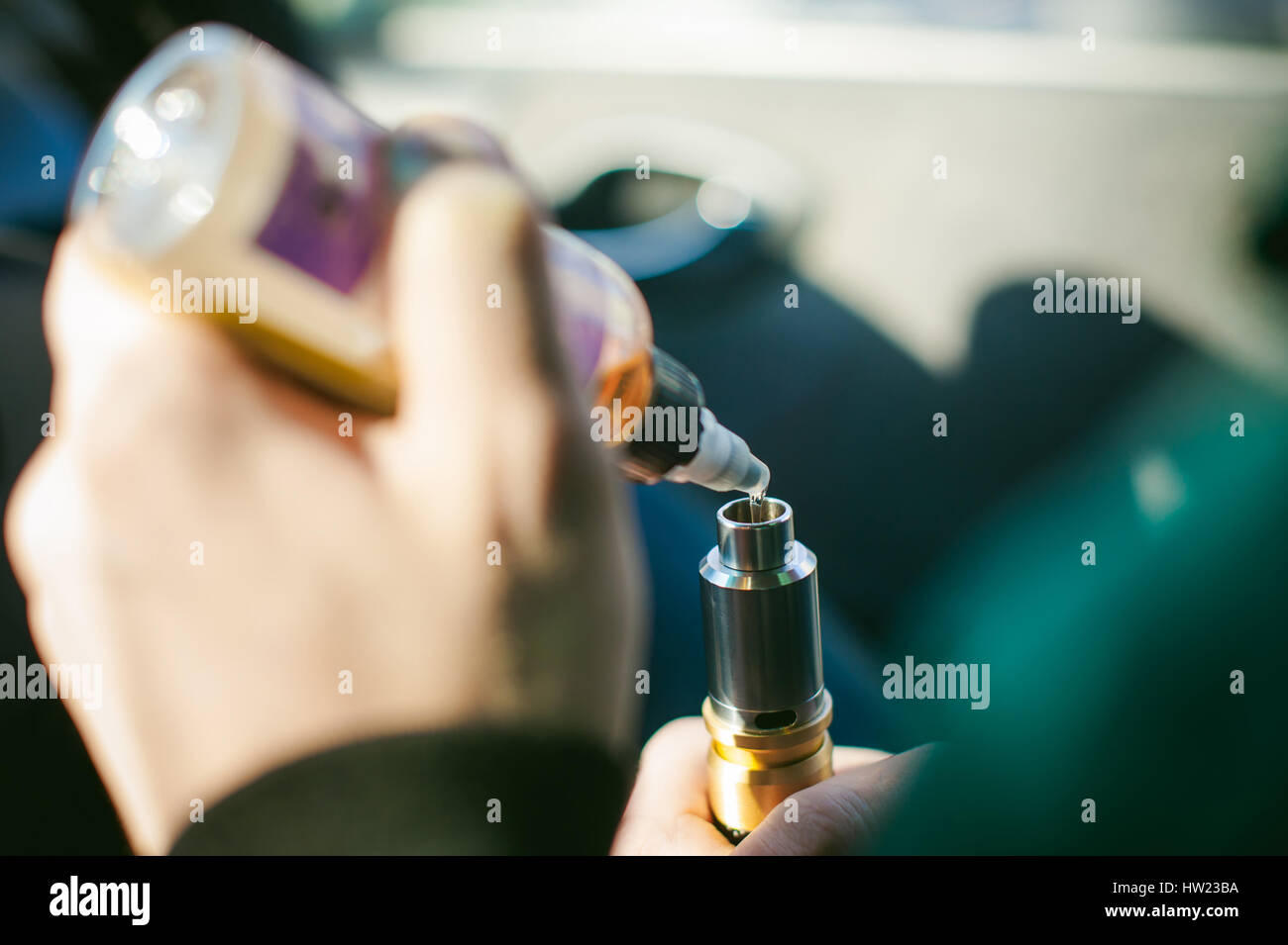 young vaper man with beard vaping mechanical mod. Guy smokes an ...