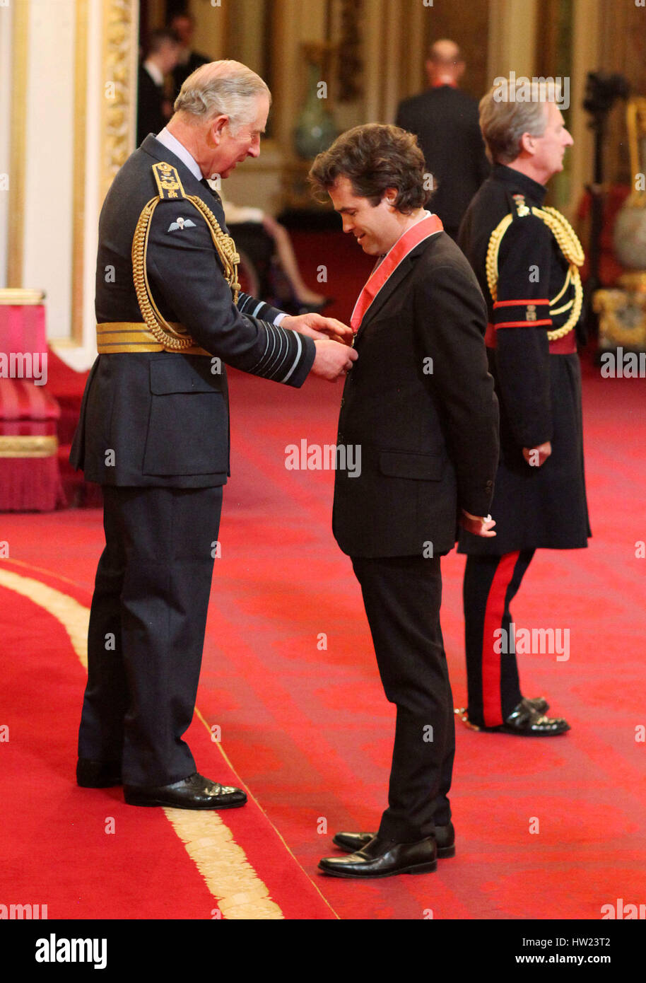 Rupert Goold is made a CBE by the Prince of Wales during an Investiture ...