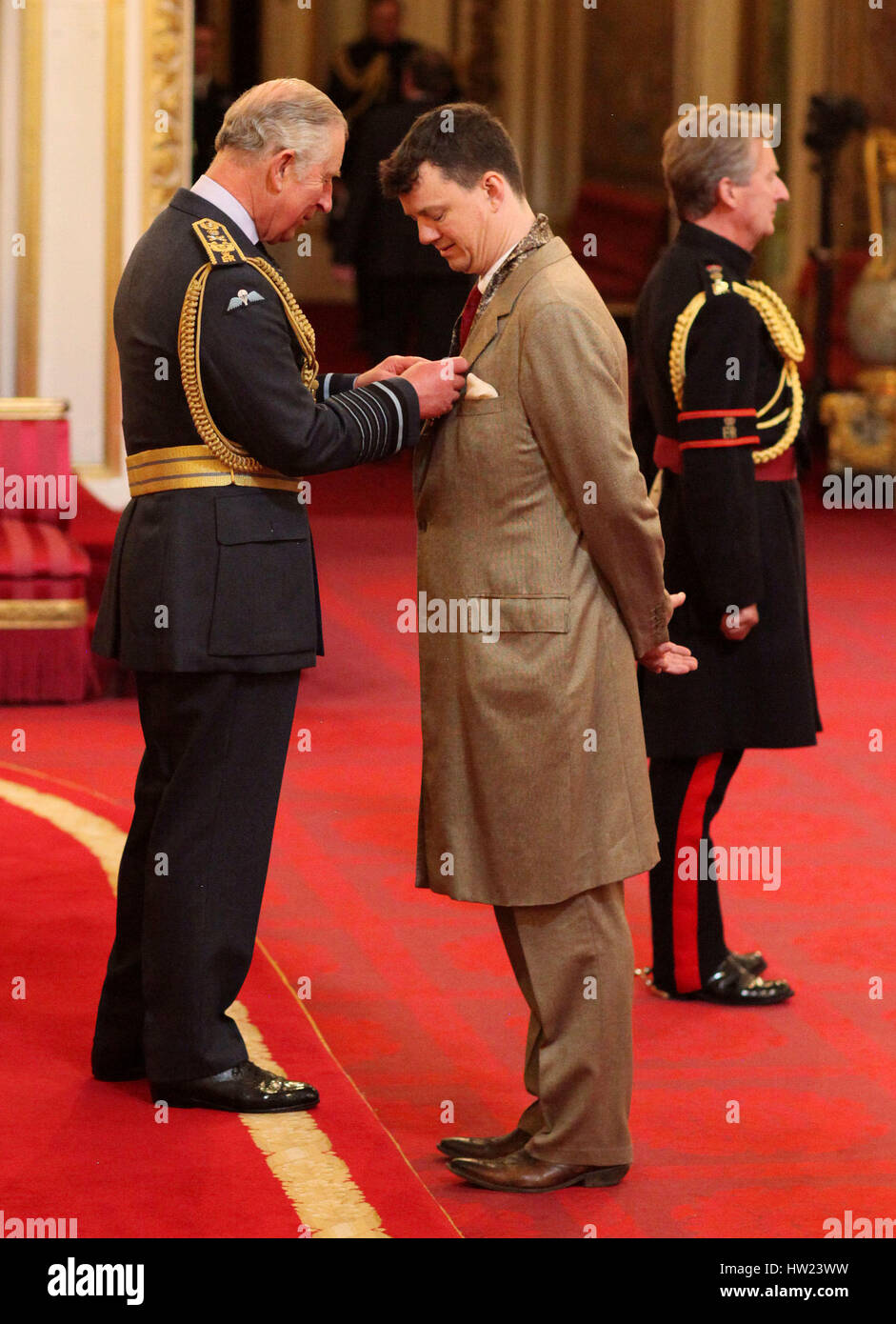Thomas Morris is made an OBE by the Prince of Wales during an ...